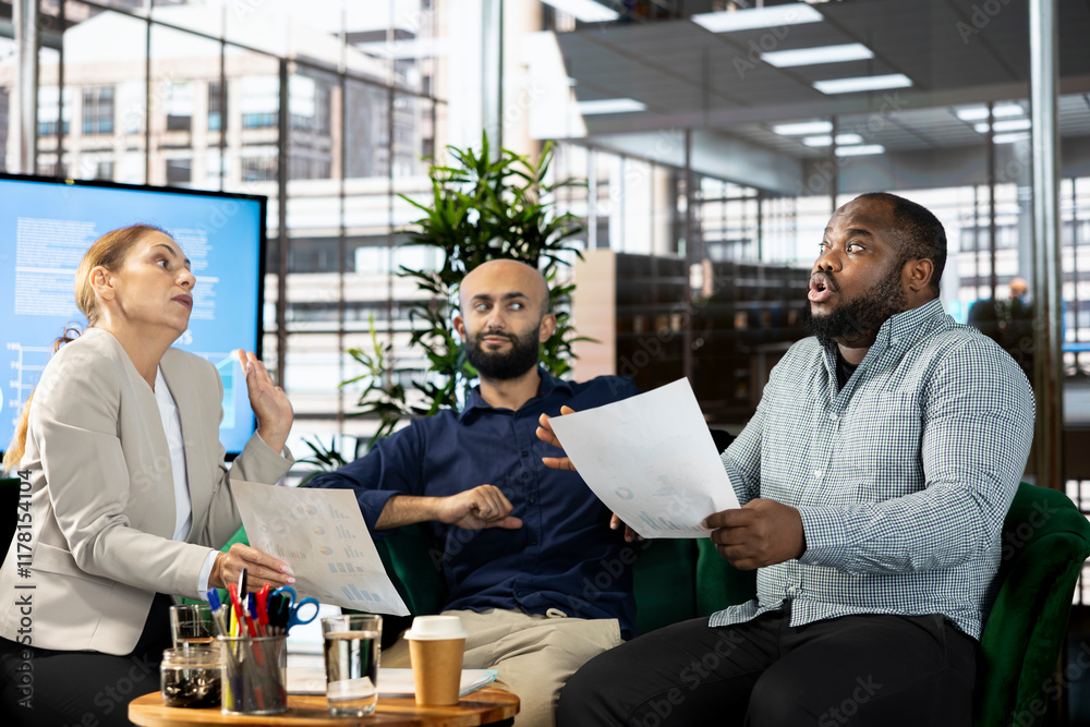 Upset diverse team of employees arguing after making mistake while ...