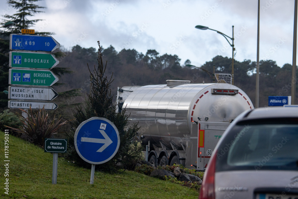 France, 21 December 2024 : Road signs and tanker truck at intersection ...