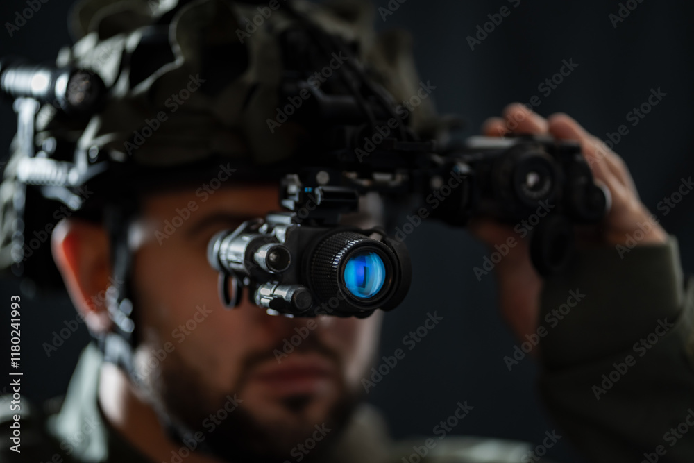 A modern warrior using night vision monocular and thermal imaging in ...