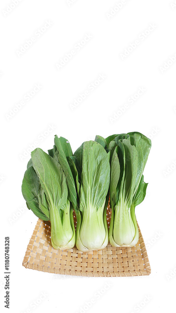 Mustard greens (bok choy) in triangle shaped woven bamboo isolated on ...