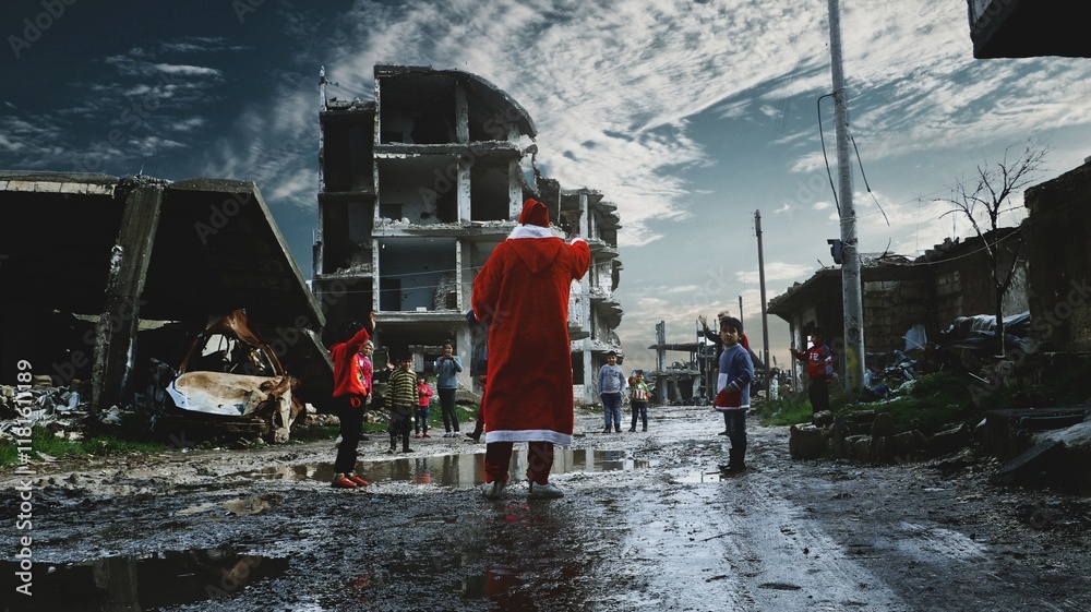 Santa Claus visits children in Syria amid destruction and devastation ...