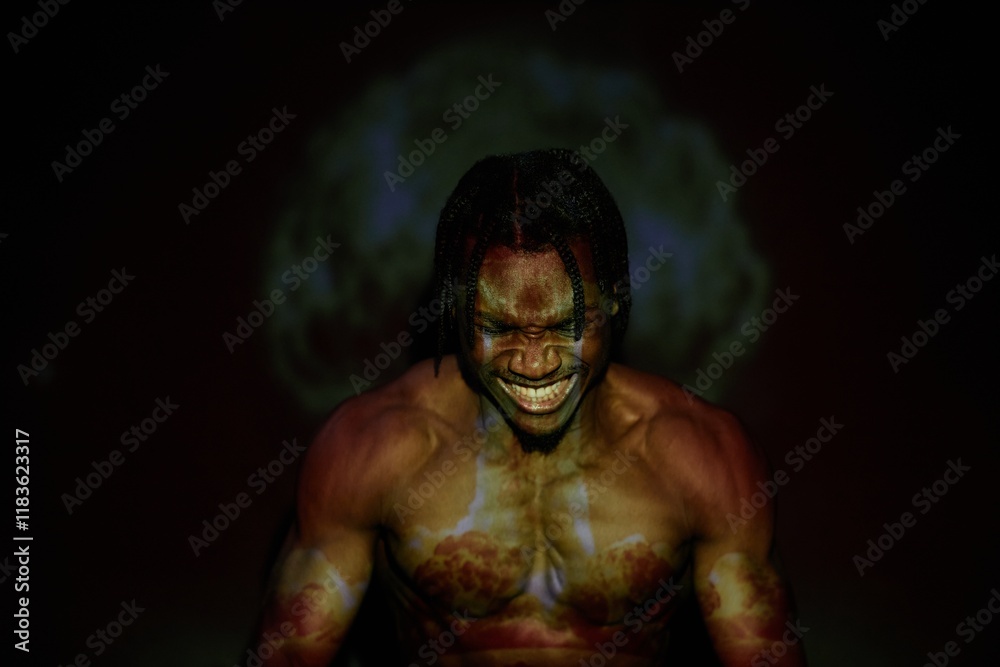 Chest up portrait of shirtless Black man screaming in feeling of rage ...