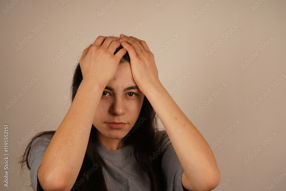 Her body language conveys a sense of realization. This moment captures ...