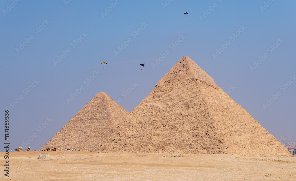 Hang gliders flying down to land beside the pyramid of Khafre and Great ...