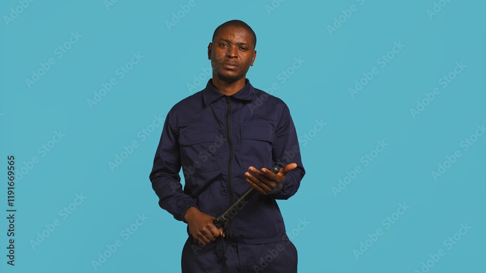 Security guard smacking hand with baton, intimidating suspects ...