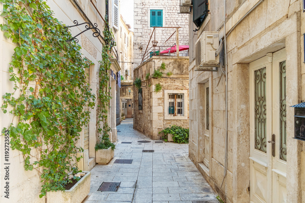 narrow street in the historic old city of Split with medieval bricks ...