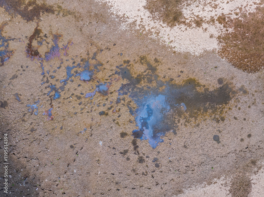 Chemical wastes close up. Dry and cracked ground background. Global ...