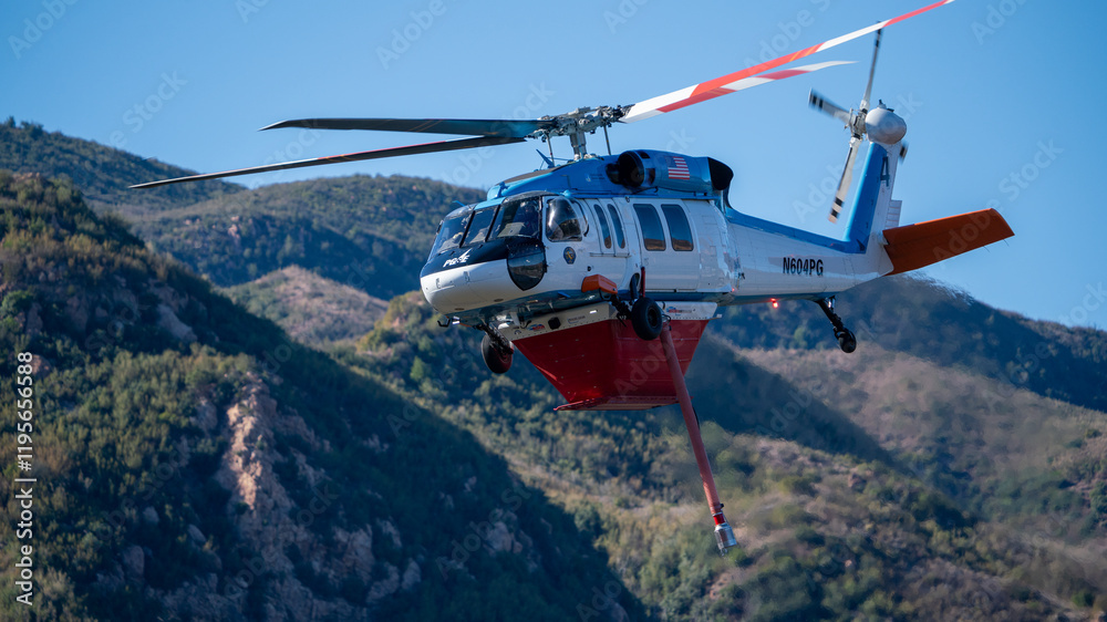 Firefighting Helicopter draws water from Lake Malibou Ca. in Los ...