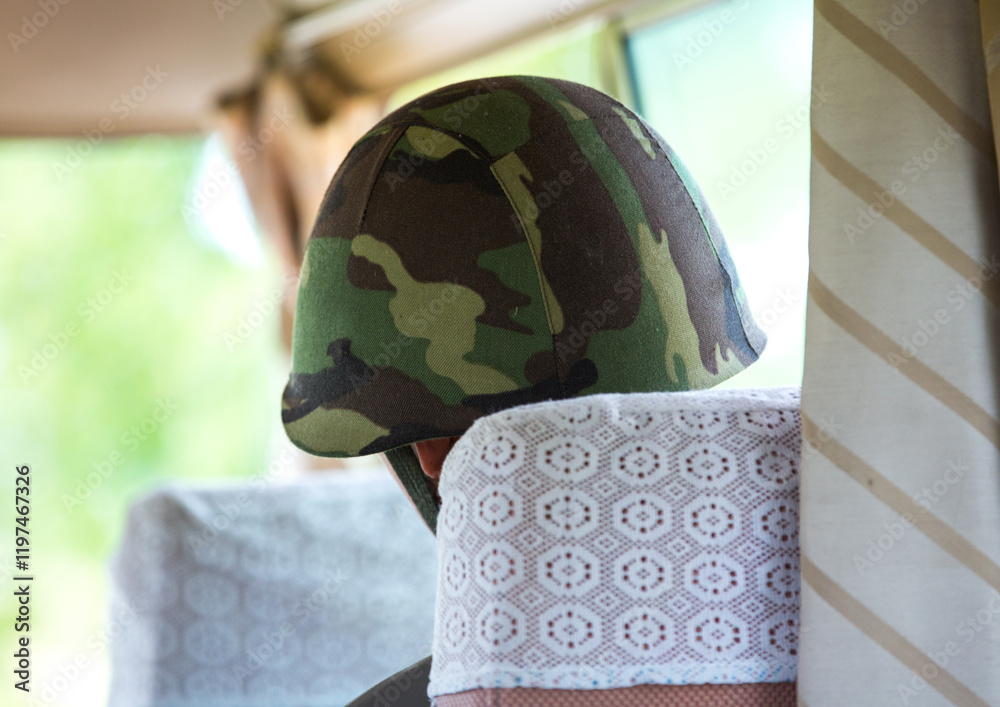 North Korean soldier wearing an helmet in a tourist bus on the ...