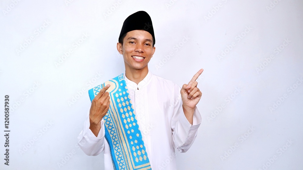 handsome asian muslim young man smiling posing pointing up using both ...