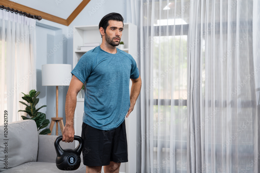 Athletic body and active sporty man lifting kettlebell weight for ...