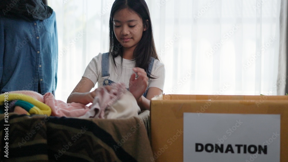 Recycling, Donation for poor, Asian girls packing objects at home ...
