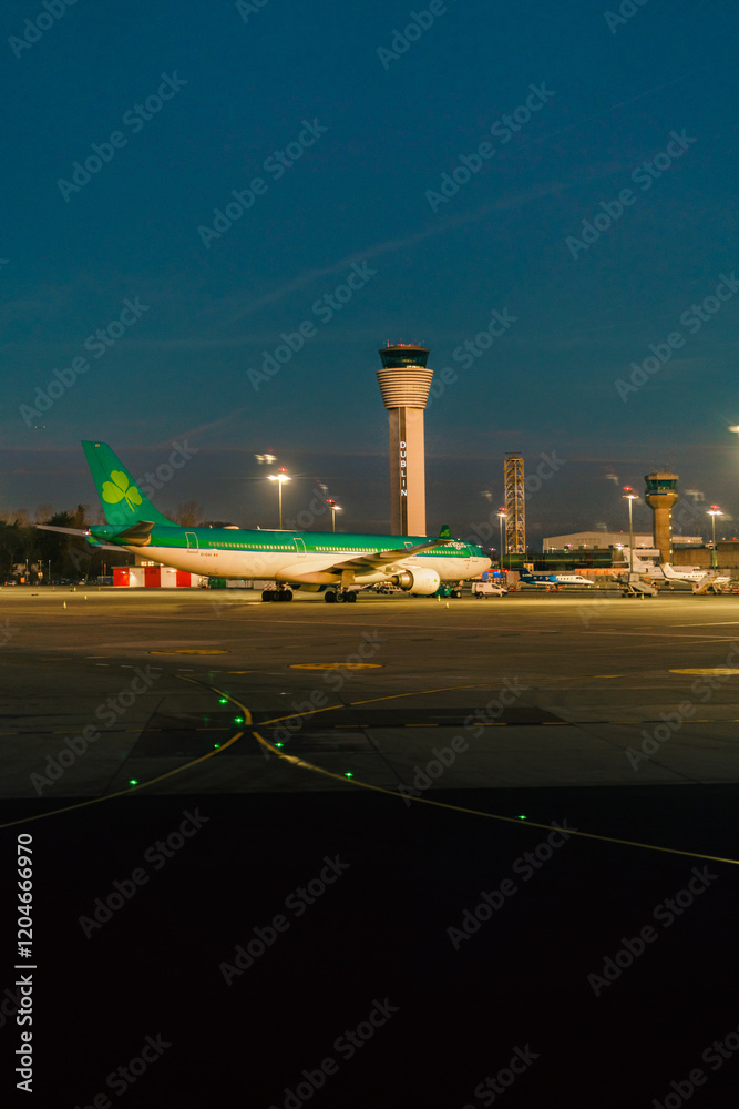 Air traffic control tower with sunrise sky at Dublin Airport in Ireland ...