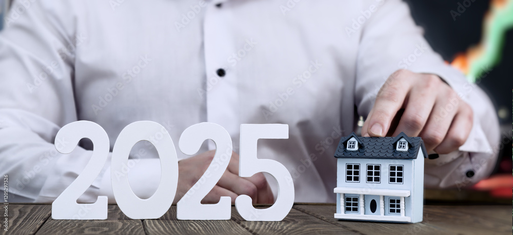 2025 Real Estate Vision: Hands Holding a Model House with Stock Market ...