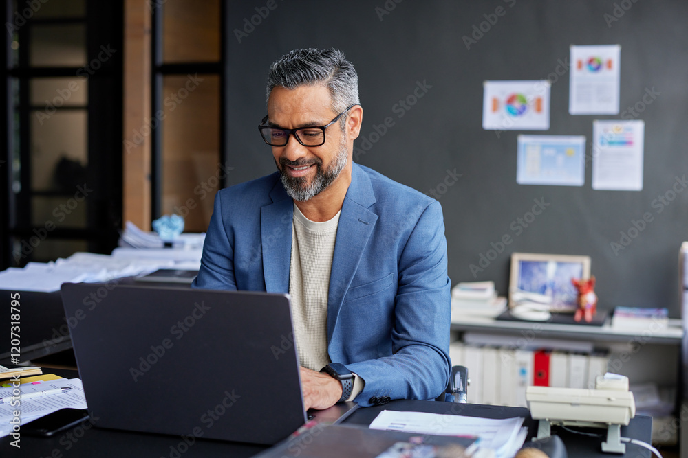 Successfull middle eastern man using laptop at work Stock Photo | Adobe ...