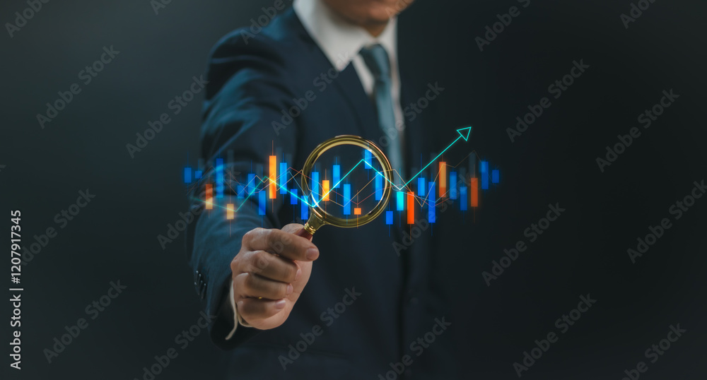 Investor or trader hold magnifying glass showing virtual candlestick ...