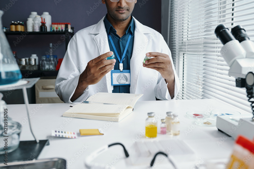 Scientist wearing lab coat and working in a modern laboratory setting ...
