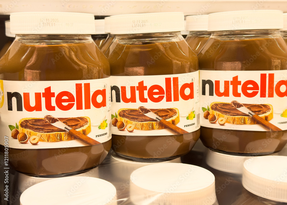 Nutella jars on shelf with hazelnut spread packaging close-up Stock ...