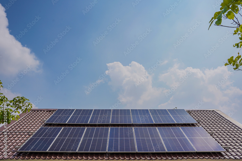 Solar panels installed on a rooftop under a clear blue sky, showcasing ...