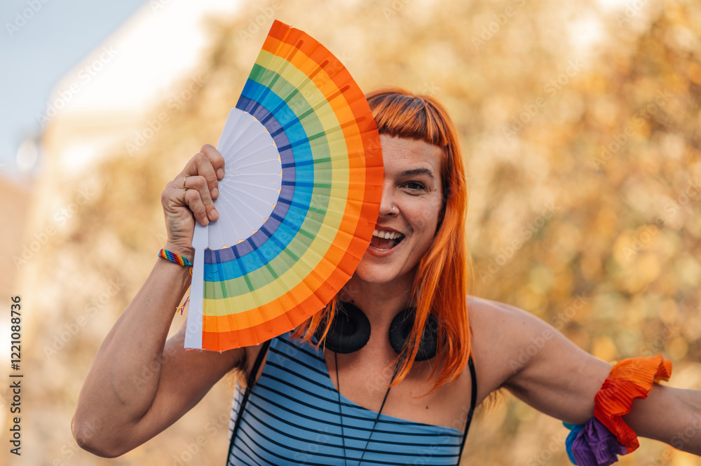 Happy activist hiding face with rainbow fan at lgbt parade Stock Photo ...