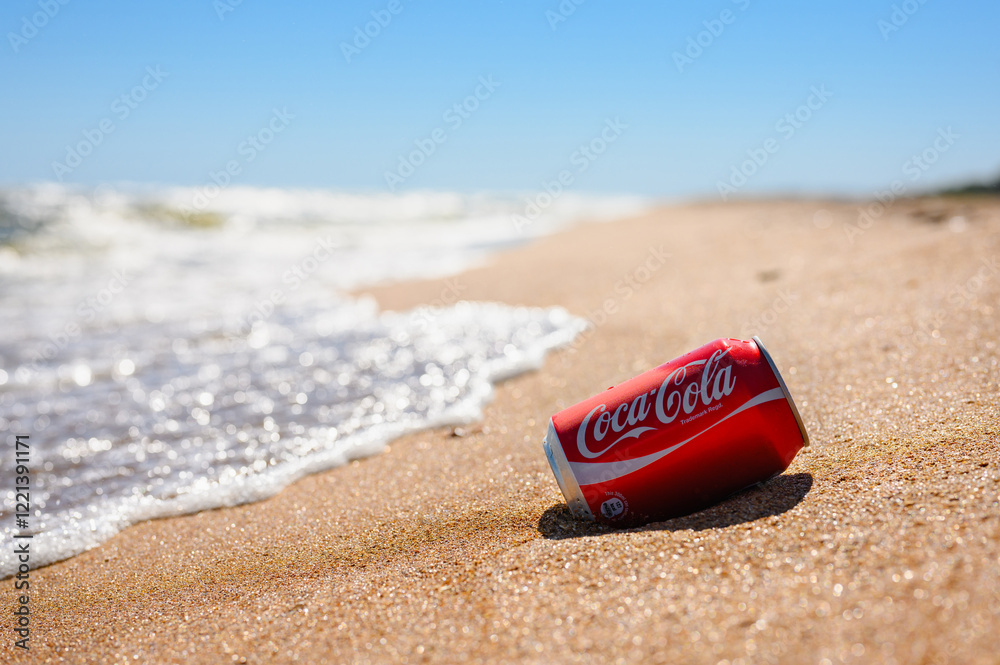 Anapa, Russia - July 2023: Can of cold Coca-Cola on a sandy beach on a ...