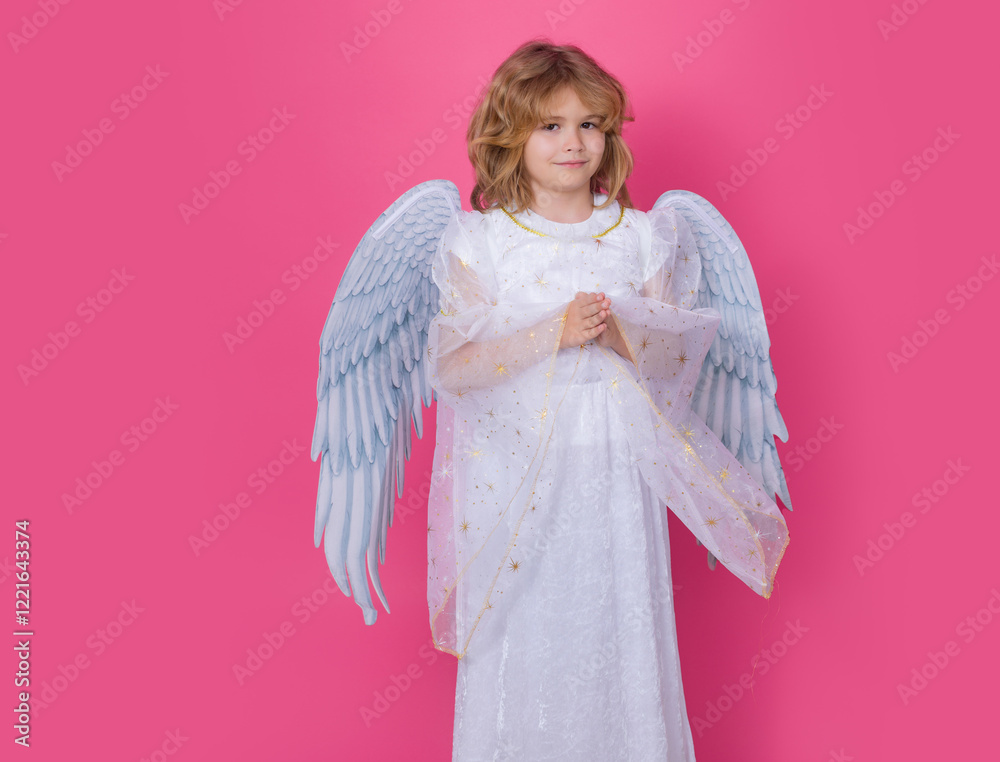 Child angel. Portrait of cute kid with angel wings isolated on pink ...