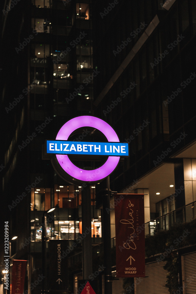The underground sign of the Elizabeth line at night - stretches for ...