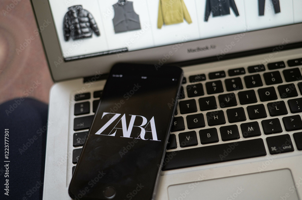 Zara logo on the screen of mobile phone. Fast fashion industry Stock ...