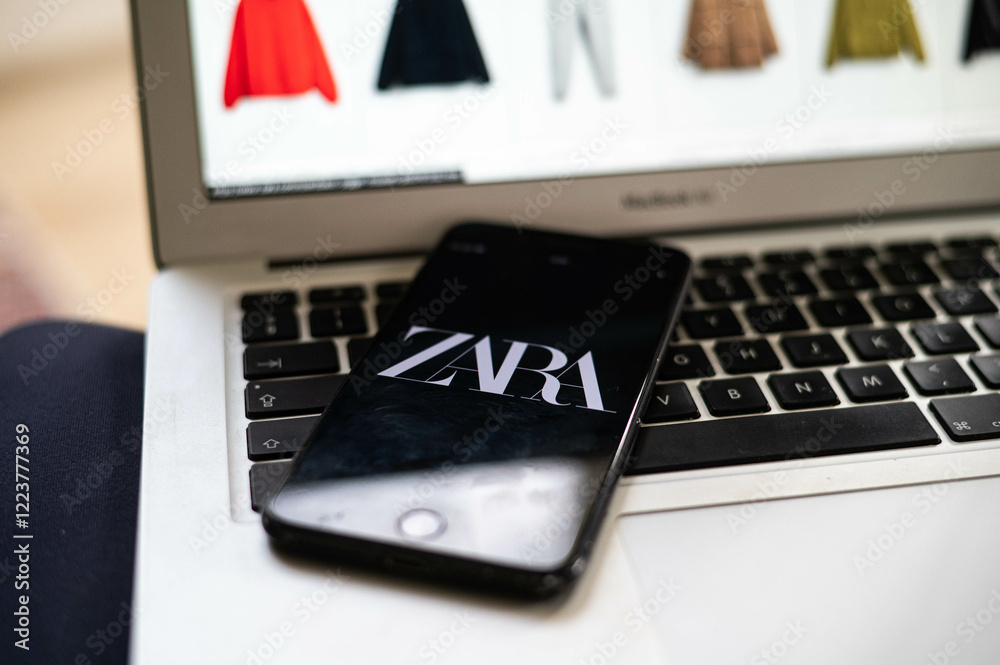Zara logo on the screen of mobile phone. Fast fashion industry Stock ...