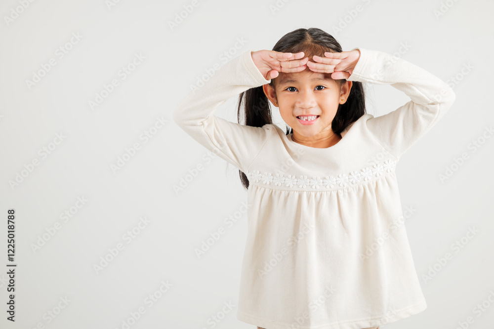 Searching concept. Asian young girl kid looking far away with hand over ...