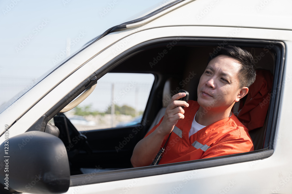 Asian male ambulance staff member in ambulance car. Wearing ambulance ...