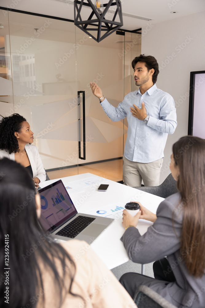 Motivated young business professional man holding presentation ...