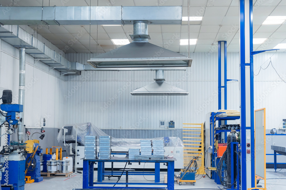 Modern industrial factory interior with equipment and ventilation ...