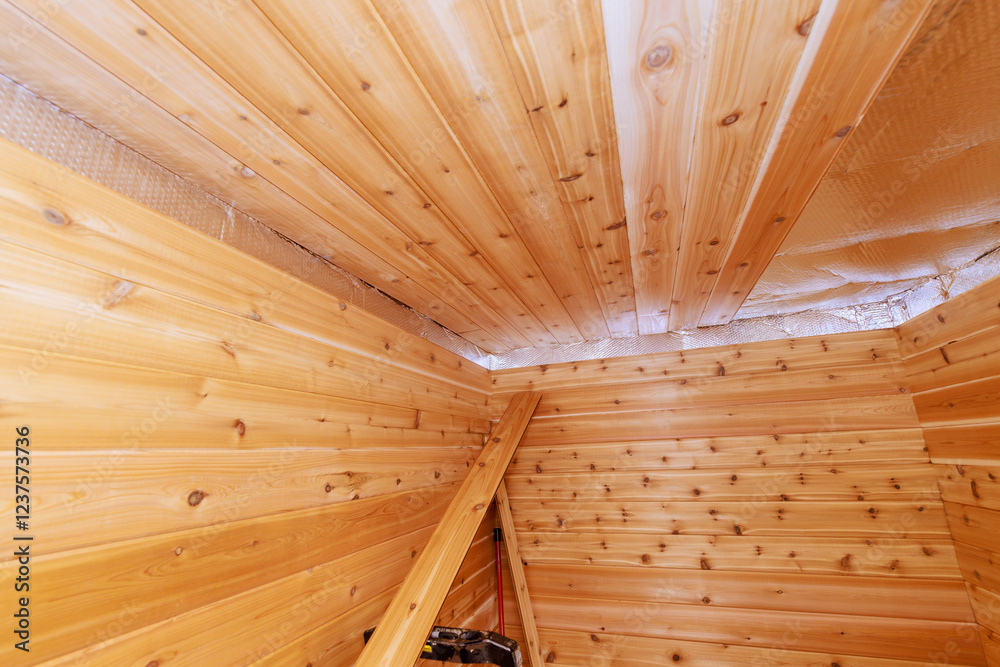 Warm wooden ceiling features beams planks in remodeling sauna cabin ...