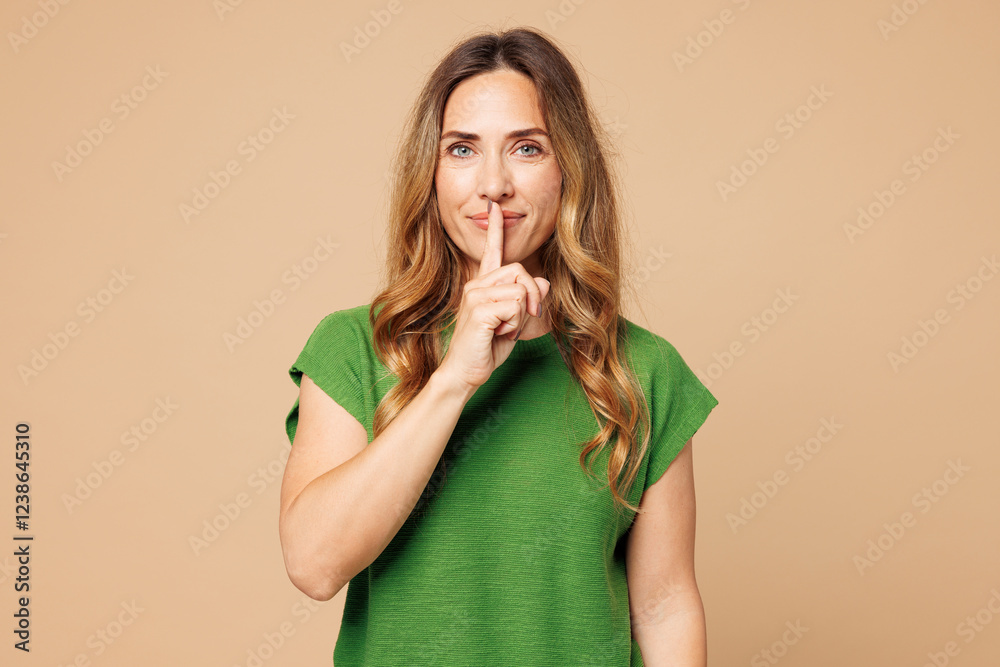 Young woman she wearing green t-shirt casual clothes say hush be quiet ...