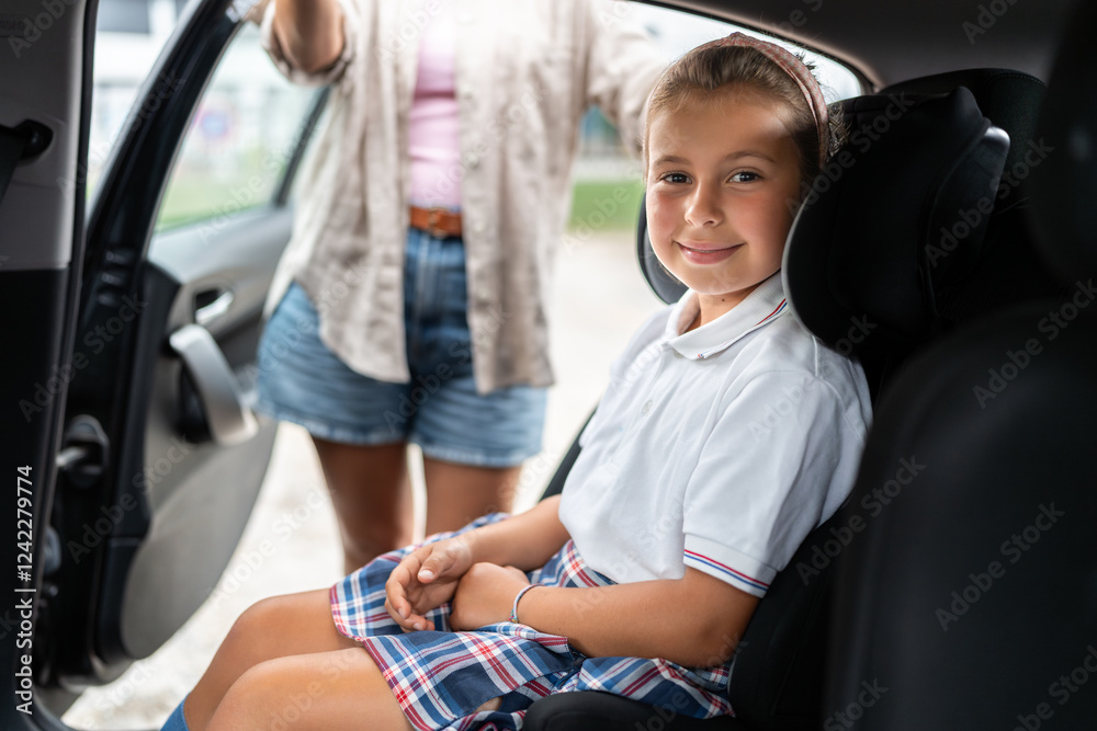 Schoolgirl smiling sitting in car getting ready for school run Stock ...