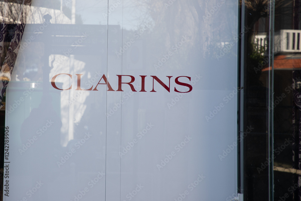 Clarins beauty shop brand logo and text sign chain on display facade ...