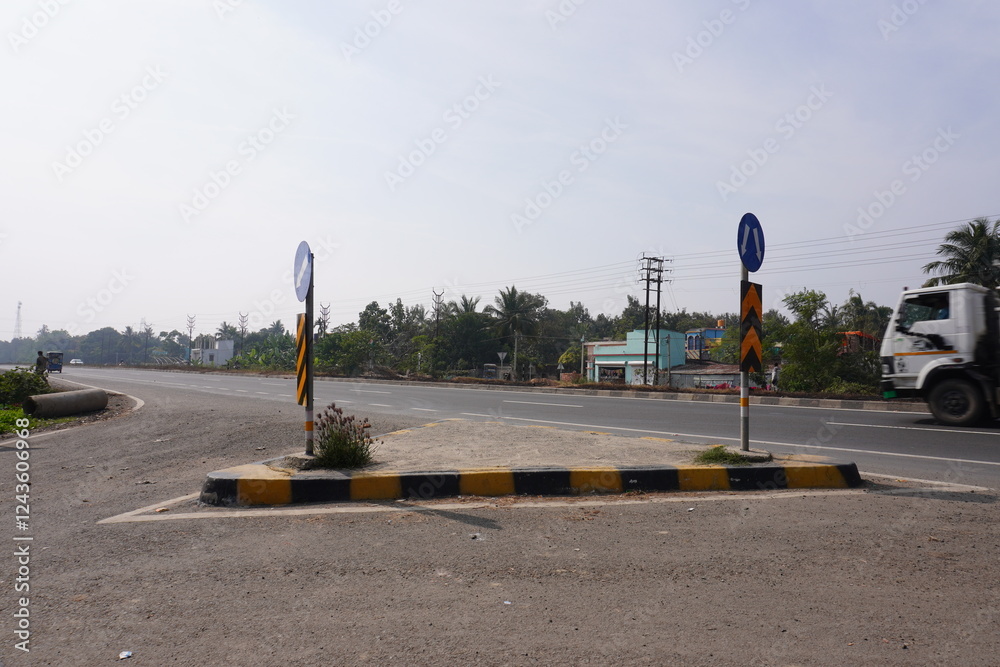 The triangle road divider in the middle of the three way with road ...
