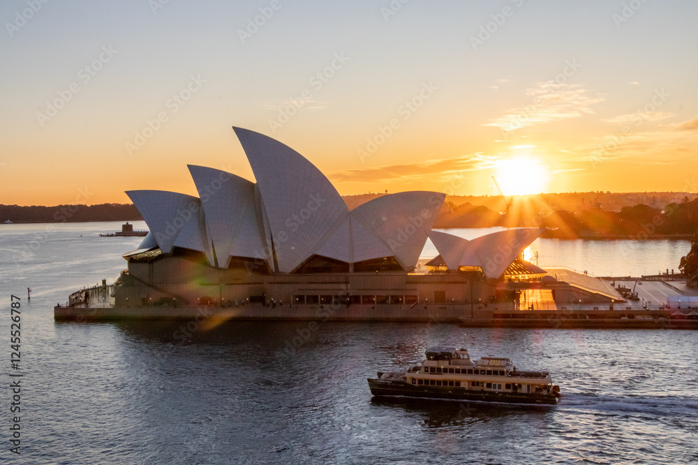 Aerial view of a ferry passing in front of Sydney's iconic Opera House ...