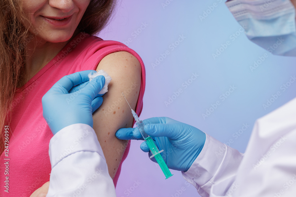 Hand of young female nurse, doctor giving syringe with vaccine, giving ...
