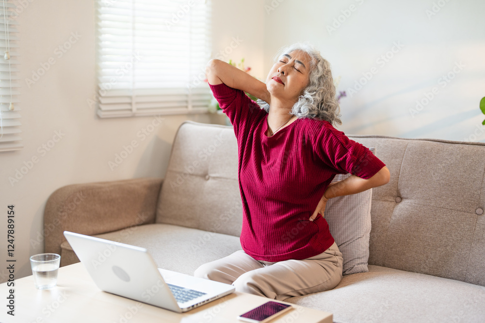 Worried upset middle aged mature woman feel hurt sudden back ache touch ...