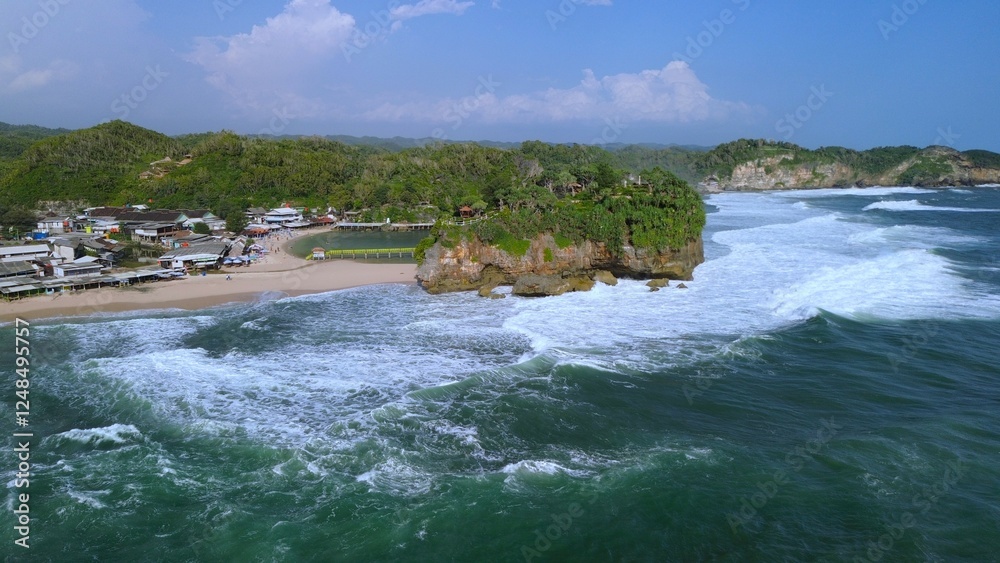Aerial Drone view of the beach with white sand, coral rocks, hills with ...