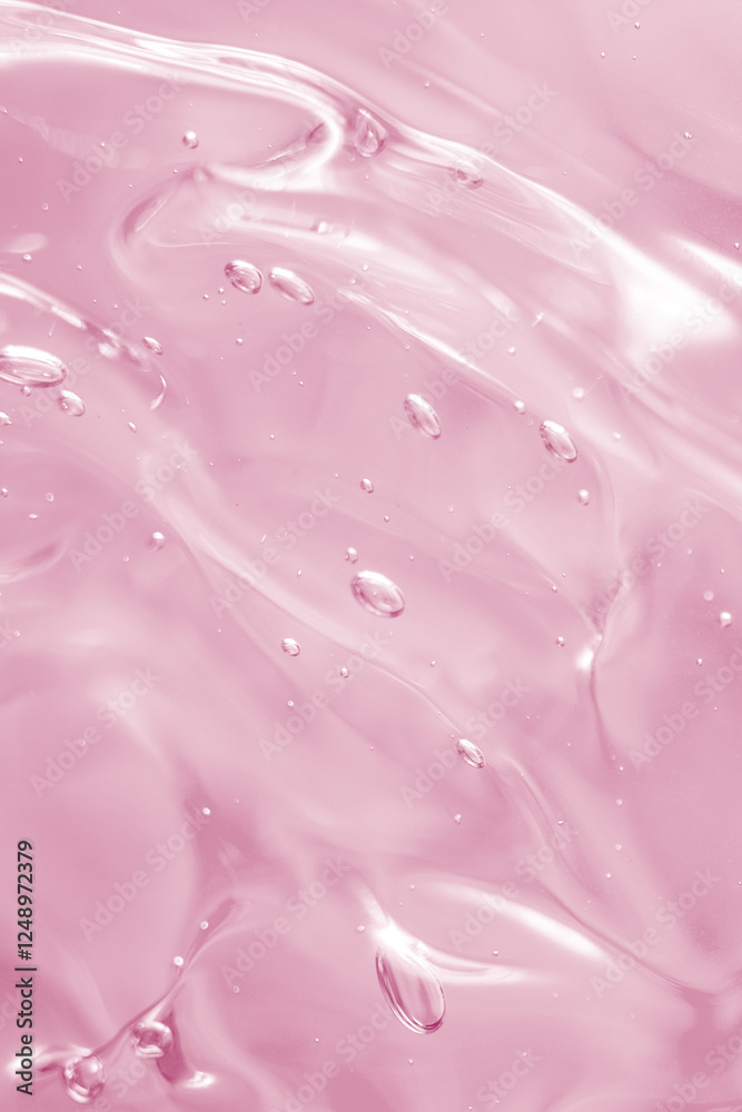 Abstract soft pink liquid with flowing texture and bubbles on a soft ...