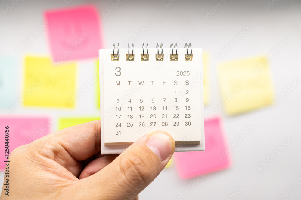 Hand holding mini calendar for MARCH 2025 background. Calendar concept ...
