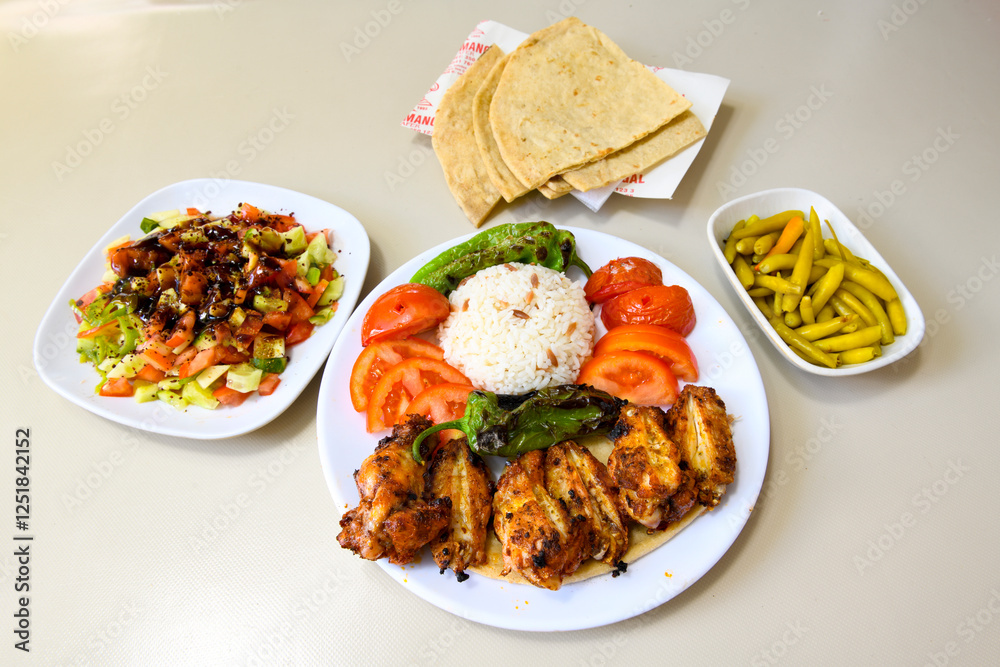 Chicken wings barbeque in a dish with BBQ grill sauce . Izgara tavuk ...