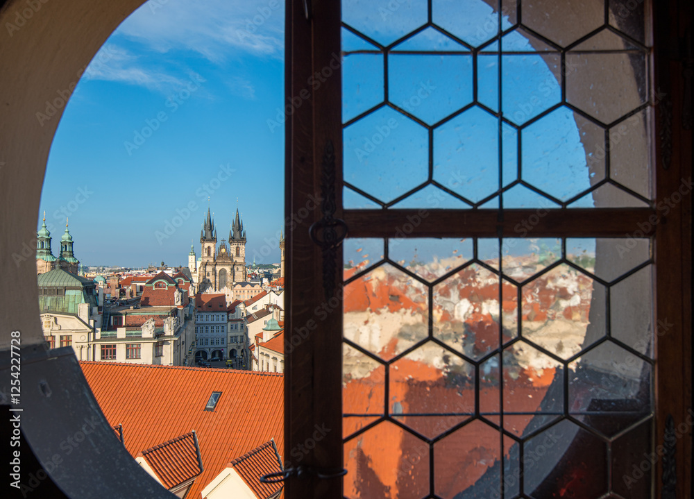 View of Prague rooftops and church towers from a circular window Stock ...
