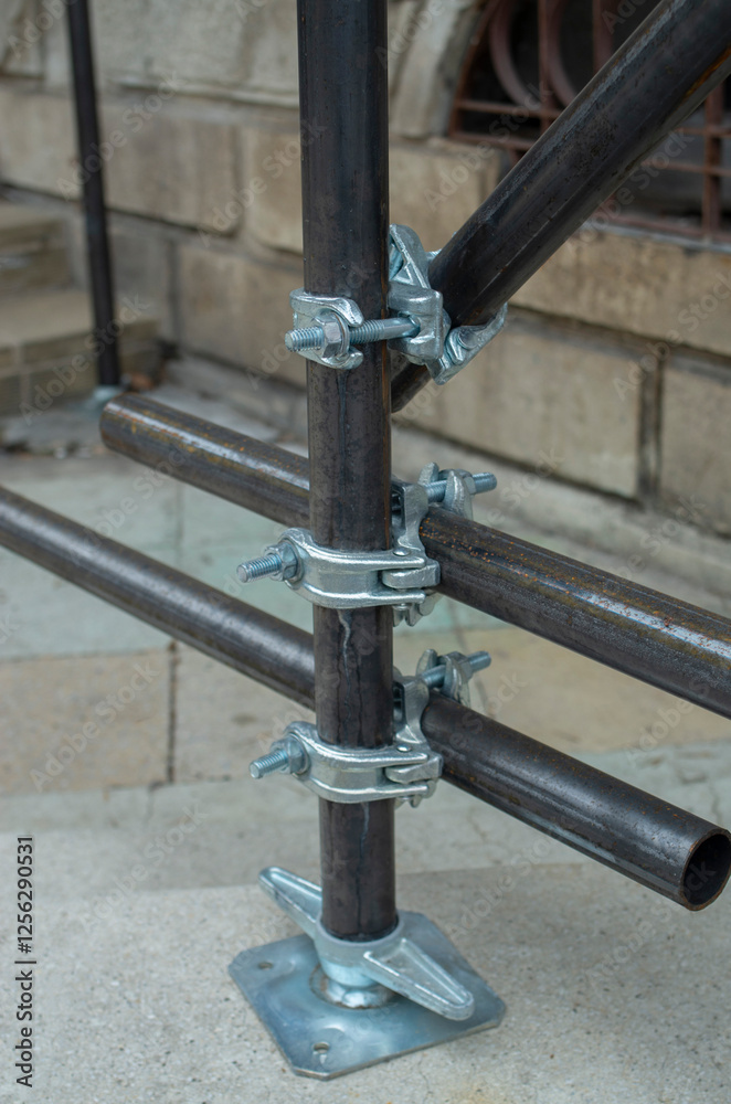 Three new scaffold double fix clamp and scaffold pipes for build the ...