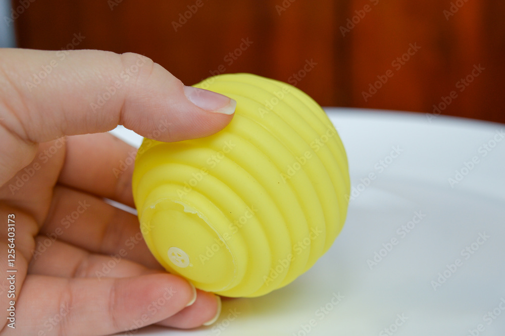 hand holding sensory textured ball babies toddlers tactile stimulation ...