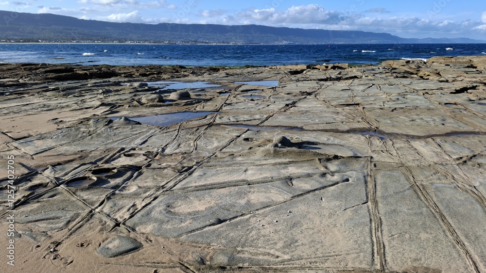 Ocean rock ledge with geological lines Stock Photo | Adobe Stock