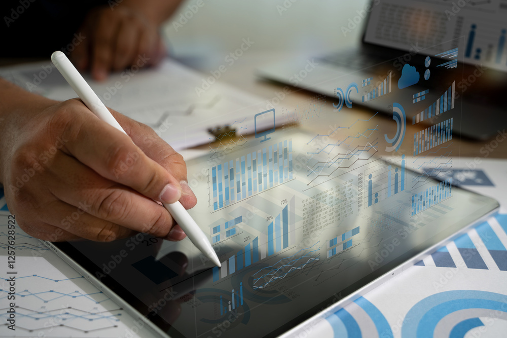 businessman write Statistics Data on a tablet, which is displaying a ...